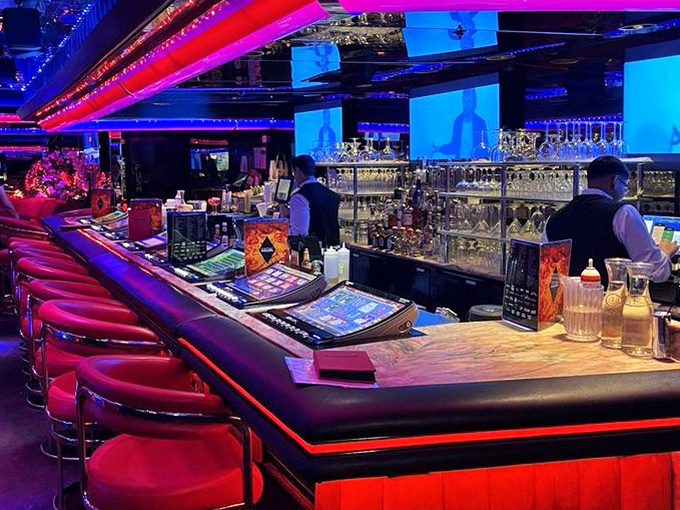 The bar where cocktail artistry meets Vegas showmanship. Those red stools have supported the elbows of celebrities, tourists, and locals alike.