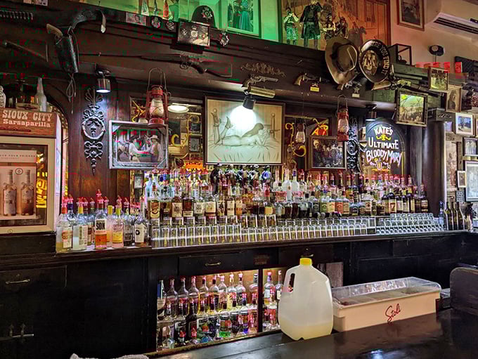 Behind every great saloon is a bar that could tell tales taller than the bottles lined up in formation. The green glow adds just the right touch of frontier mystique.