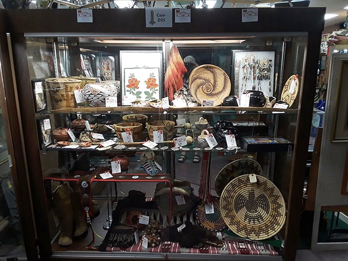 Cultural crossroads in a single display case. These Native American artifacts represent craftsmanship that predates Oklahoma statehood by centuries.