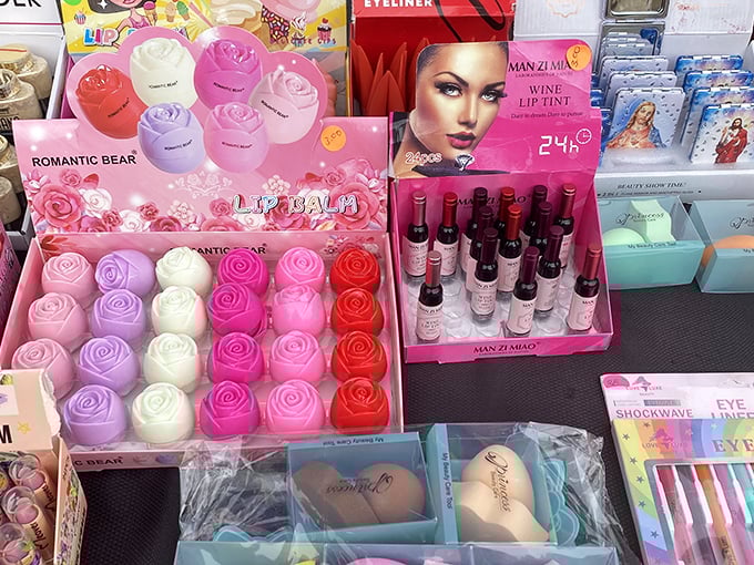 Rose-shaped soaps and colorful cosmetics transform this table into an impromptu beauty counter where affordable glamour is the main attraction.