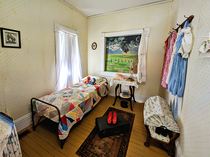 Dorothy's bedroom, complete with the quilt she left behind when the tornado hit. Those ruby slippers await their starring role.