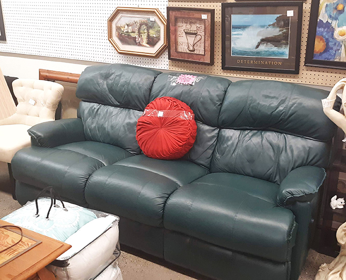 That green leather sofa has seen things, told stories, and is ready to become the centerpiece of someone's "I can't believe I found this" tale.
