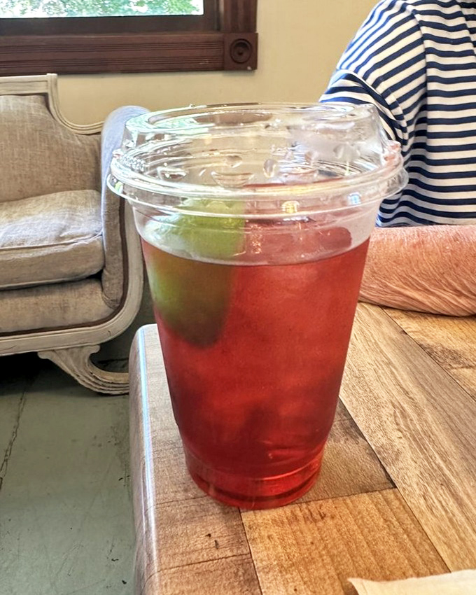 Ruby-red iced tea with a lime garnish—because sometimes your sweet tooth needs a refreshing timeout. The perfect companion to any pastry adventure.