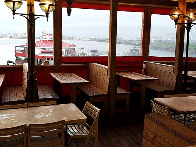 Window seats offering bay views that pair perfectly with steamed crabs. Nature's television program: Boats, Birds, and Beautiful Horizons.