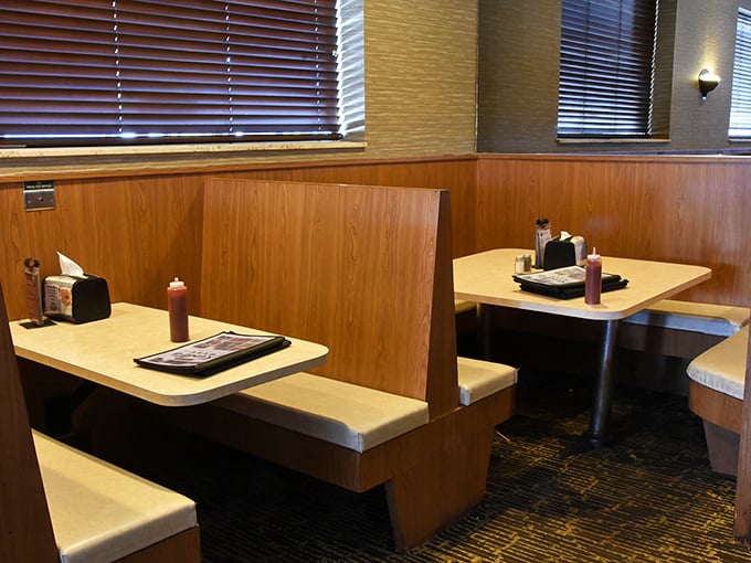 These booths have witnessed more Packers victory celebrations and defeat consolations than most therapists. The ketchup bottles? Sworn to secrecy.