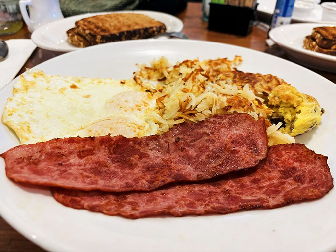 A breakfast platter that answers the eternal question: "Why choose between eggs, meat, and hash browns when you can have it all?"