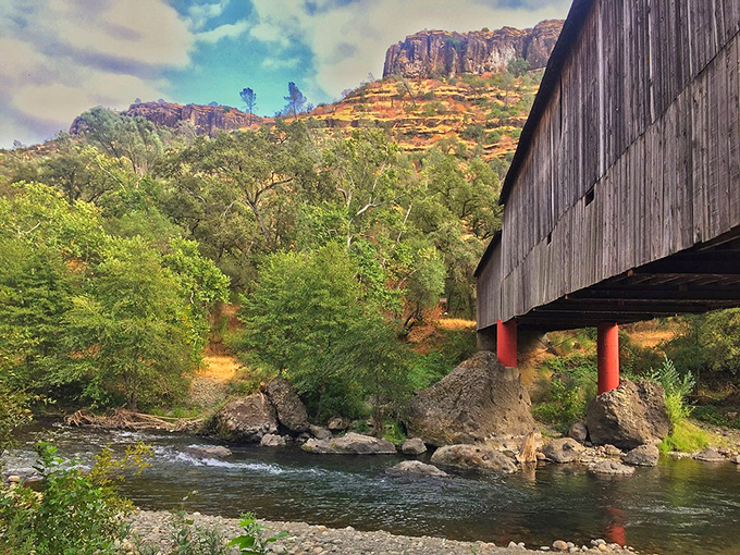 The bridge frames the rugged mountain backdrop perfectly, like Mother Nature and human engineering decided to collaborate on a masterpiece.