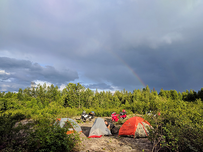 A rainbow arcs over colorful tents perched on alpine tundra&mdash;Mother Nature's way of saying, "Thanks for coming to my open house."