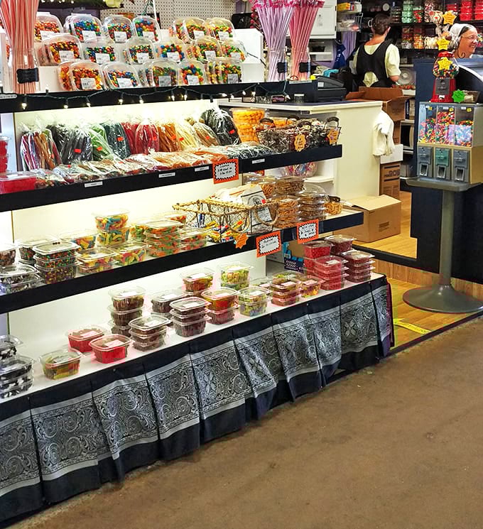 Candy displays that would make Willy Wonka jealous stand ready to satisfy sweet tooths of all ages with treats that evoke childhood nostalgia.
