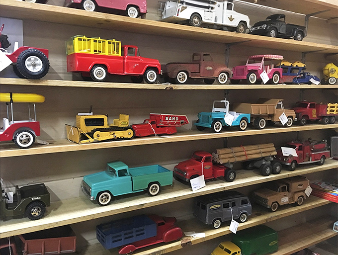 Toy trucks that survived decades of imaginary construction sites and cross-country adventures, now waiting for their next journey.