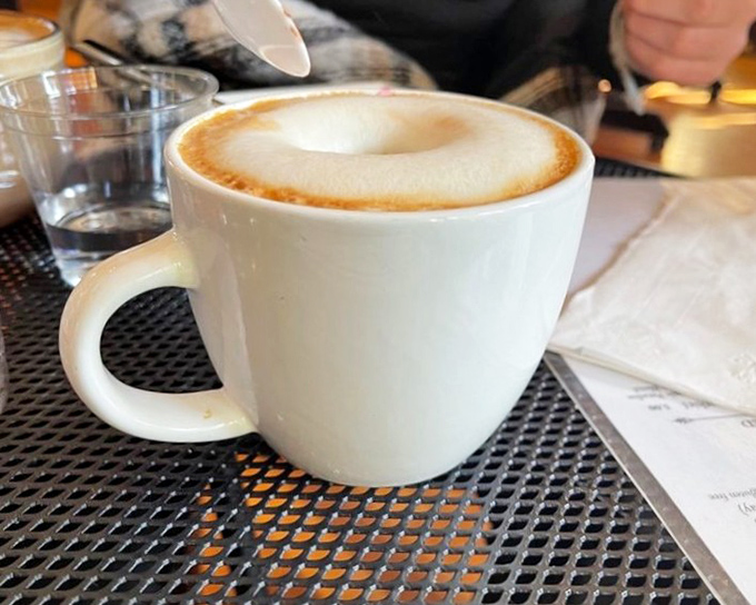 The perfect foam crown for your caffeine kingdom. This isn't just coffee; it's the ideal companion for contemplative people-watching.