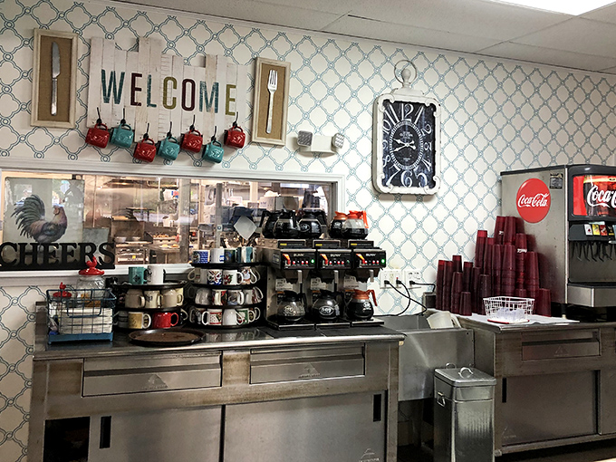 The coffee station—command central for morning revival. Those mugs stacked like soldiers ready for caffeinated duty tell you they take their brew seriously.