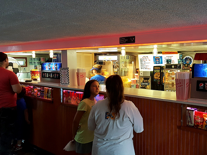 The concession stand hustle&mdash;where decisions about butter quantity and candy selection become momentarily life-altering choices.