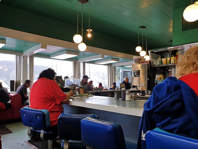 The counter view where you can watch breakfast theater unfold while eggs sizzle and hash browns get perfectly crispy.