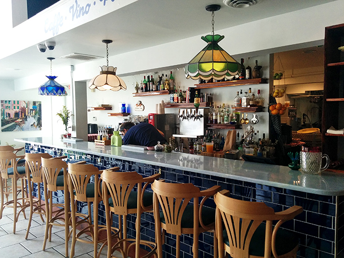 The bar area combines old-world charm with modern sensibility, like your favorite Italian uncle who somehow knows all the latest trends.