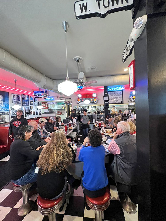 Counter seating where you can watch breakfast magic happen while making friends with strangers over shared omelet appreciation.