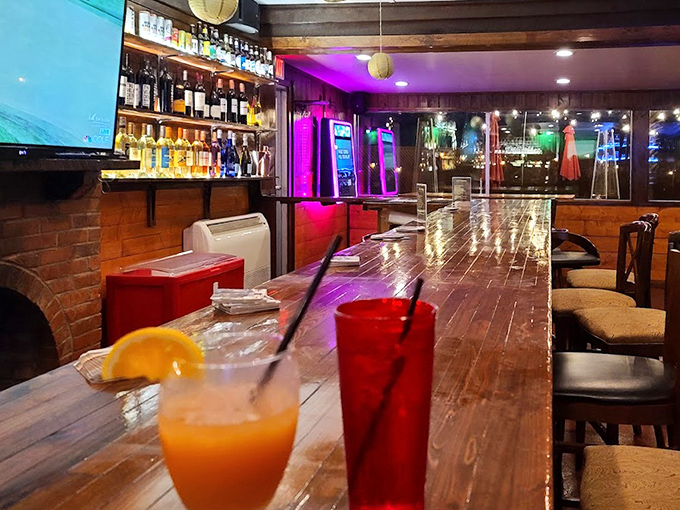 The bar counter stretches invitingly, colorful drinks standing at attention like beauty pageant contestants waiting for your vote.
