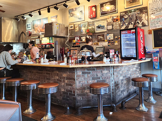 The counter—where solo diners find community, regulars claim their territory, and everyone has a front-row seat to the culinary show.