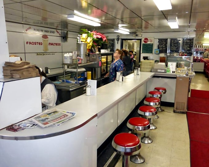 The counter where regulars don't need to order&mdash;their coffee appears magically. A diner ballet choreographed through decades of service.