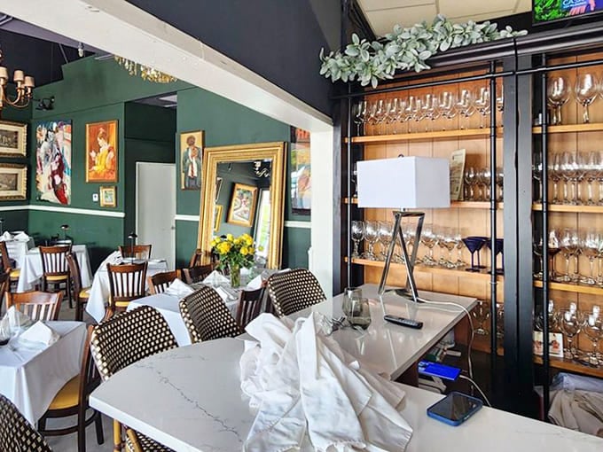 Wine glasses standing at attention behind glass, ready to complement whatever Cuban delicacy you choose. Liquid sophistication awaits.