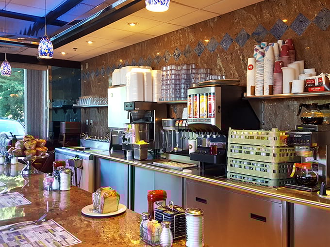 The counter area&mdash;where coffee flows freely, pastries tempt from their display, and breakfast dreams come true at any hour.