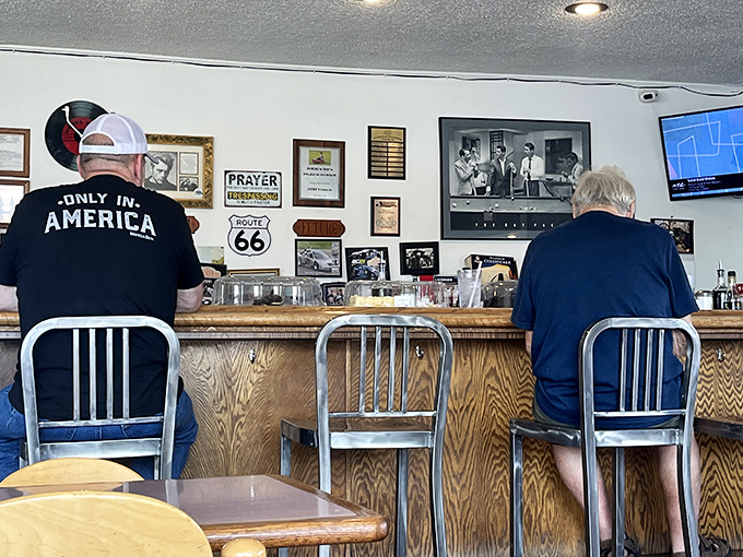Belly up to the counter where Route 66 signs and classic memorabilia transport you to simpler times.