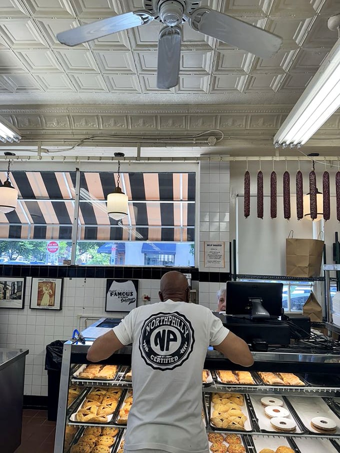 Behind the counter, where sandwich artistry happens with the precision and care of a Swiss watchmaker, but with more mustard.