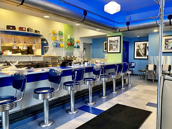 The counter where breakfast dreams come true. Those blue stools have heard more morning confessions and weekend plans than any therapist in Madison.