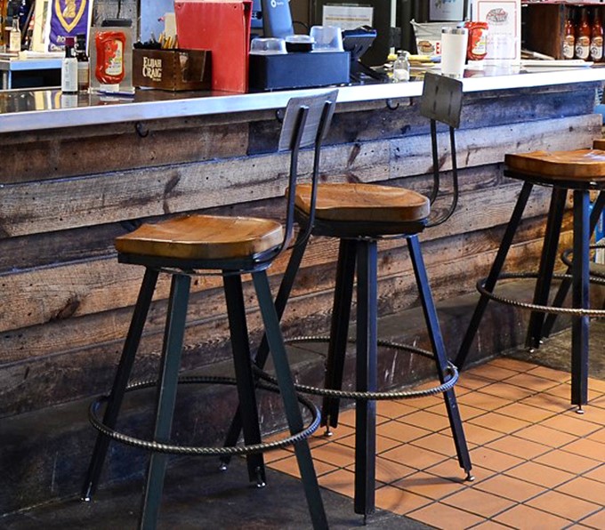 Counter seating that puts you close enough to the action to witness BBQ alchemy in progress. These stools have supported countless happy customers.