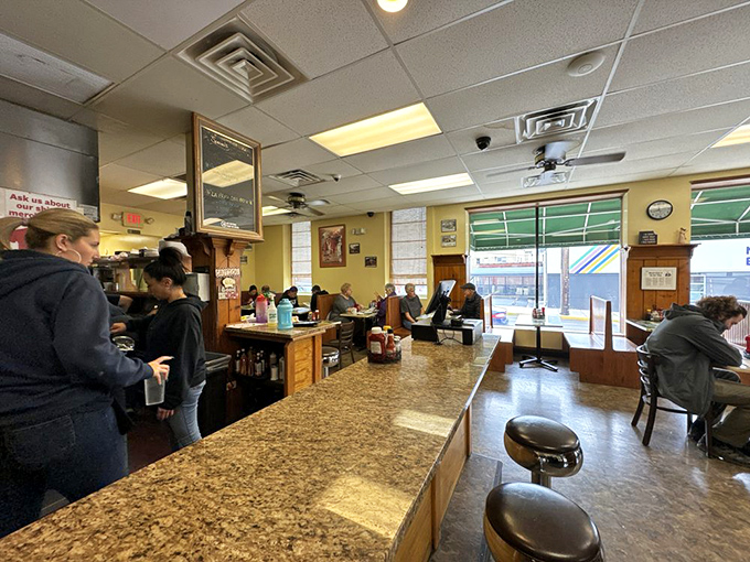Counter seating: where breakfast theater unfolds. Watch the morning ballet of spatulas and plates while perched on these front-row chrome thrones of breakfast appreciation. 