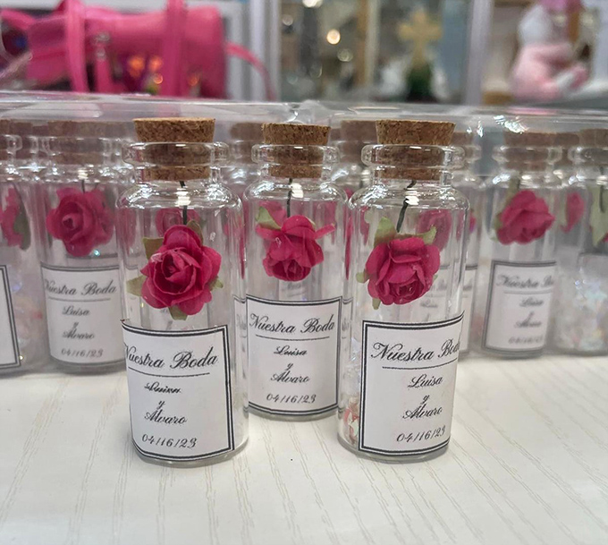 These delicate rose-filled keepsakes aren't just wedding favors&mdash;they're tiny time capsules of love, corked and ready for gifting.