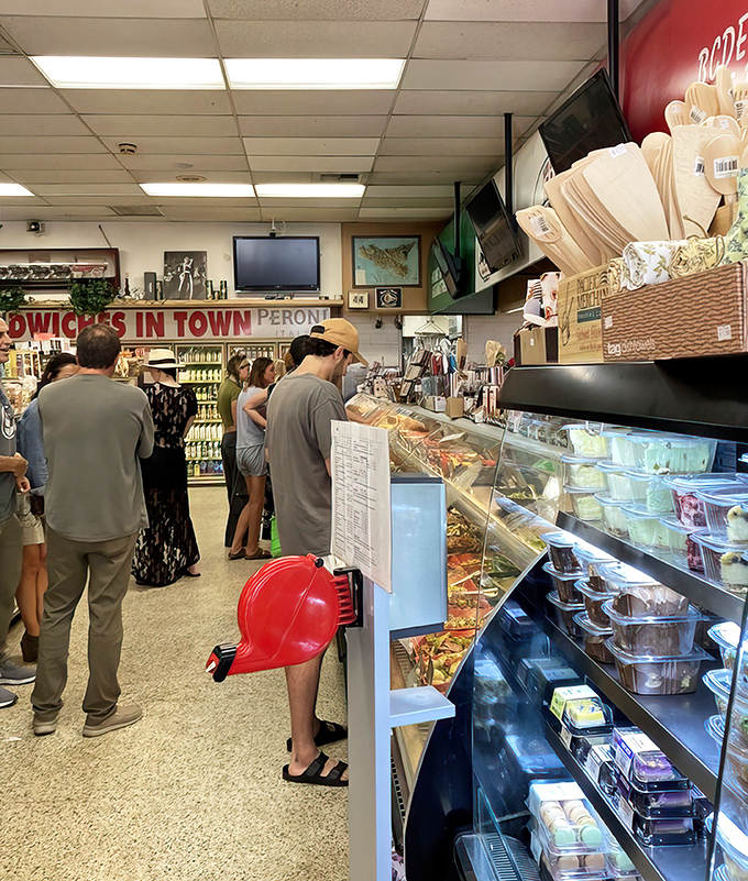 The line at Bay Cities is where strangers become comrades, united in the universal language of sandwich anticipation.