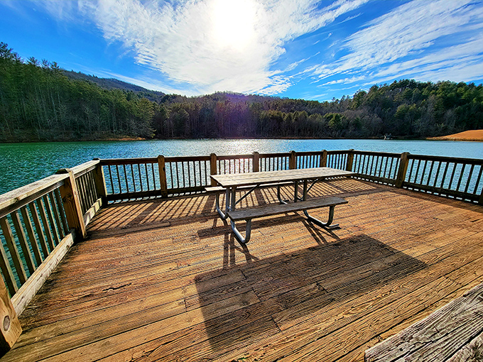 This lakeside deck practically begs for morning coffee or evening contemplation. The only difficult decision is which direction to point your chair.
