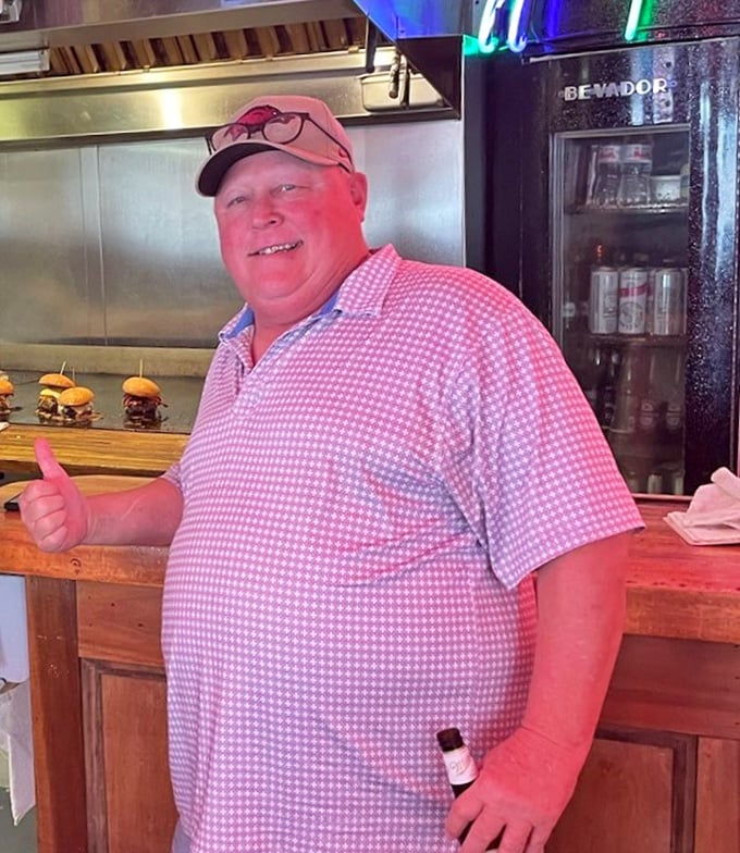 That giant Miller bottle isn't just decor&mdash;it's a monument to good times shared over great food in a place where everyone feels like a regular.