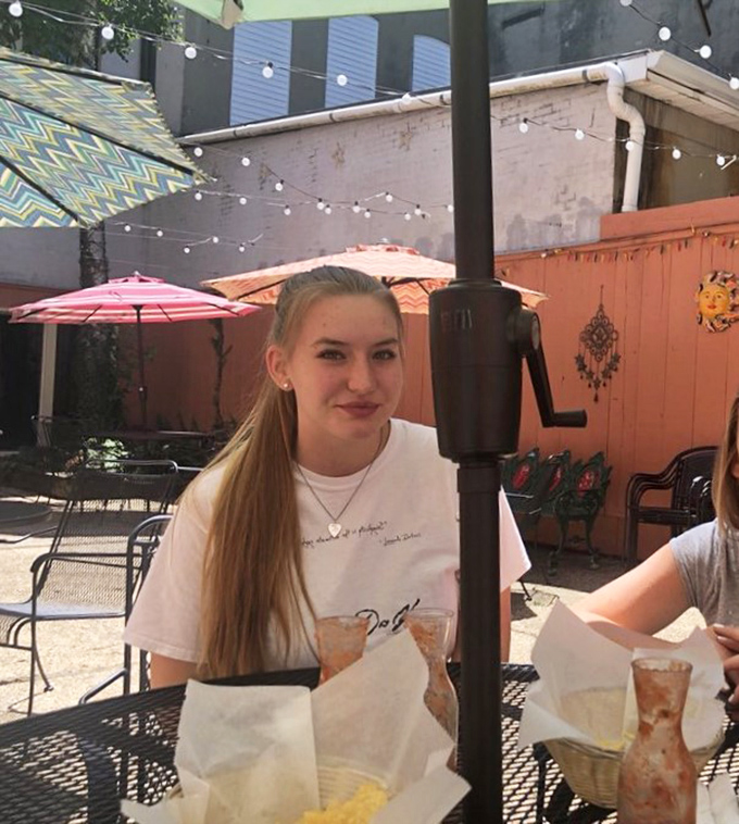 Outdoor dining with string lights overhead&mdash;where summer evenings, cold drinks, and Mexican food create memories that last through winter.