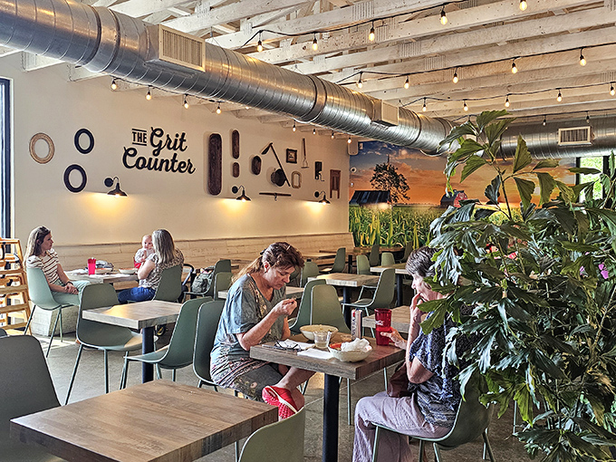 Where locals gather to worship at the altar of properly cooked grits, beneath the gentle glow of string lights and exposed beams. 