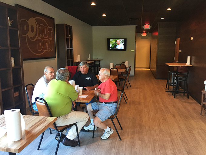 Morning regulars gather for coffee, donuts, and conversation &ndash; the holy trinity of community building that no social media platform can replicate.