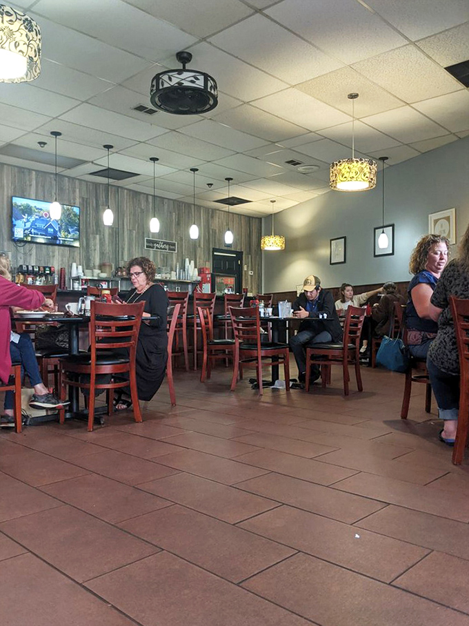 Morning regulars settle in with coffee and conversation—the true soundtrack of any great diner experience is the gentle buzz of community.