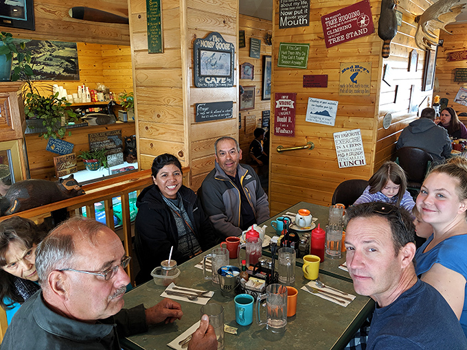 The dining room buzzes with conversation and laughter &ndash; a community gathering spot where locals and visitors break bread together under watchful taxidermy.