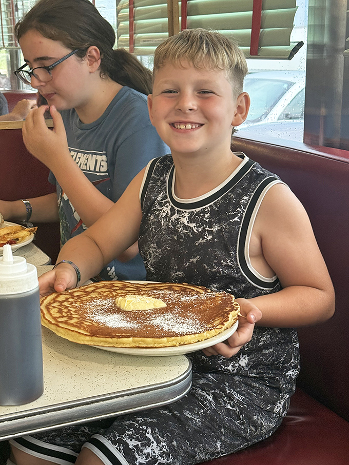 The look of pure joy that only comes from a child's first encounter with a proper diner pancake. Future food memories in the making.