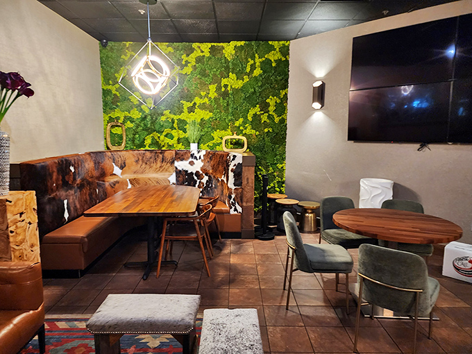 A living wall adds vibrant greenery to the rustic-chic dining space. Nature meets nurture in this thoughtfully designed corner of carnivore heaven.