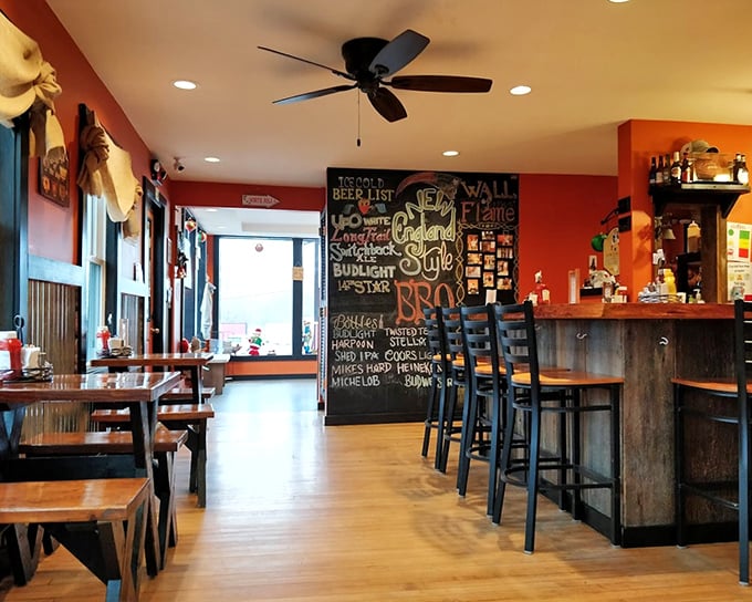 The dining area's orange walls radiate warmth like the slow-burning hickory in their smokers&mdash;casual yet inviting.