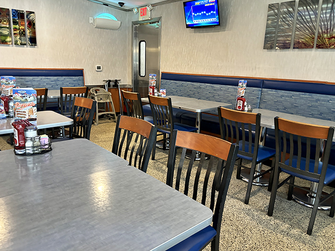 The dining area waits patiently for the next wave of hungry patrons &ndash; each table a blank canvas for future food memories.