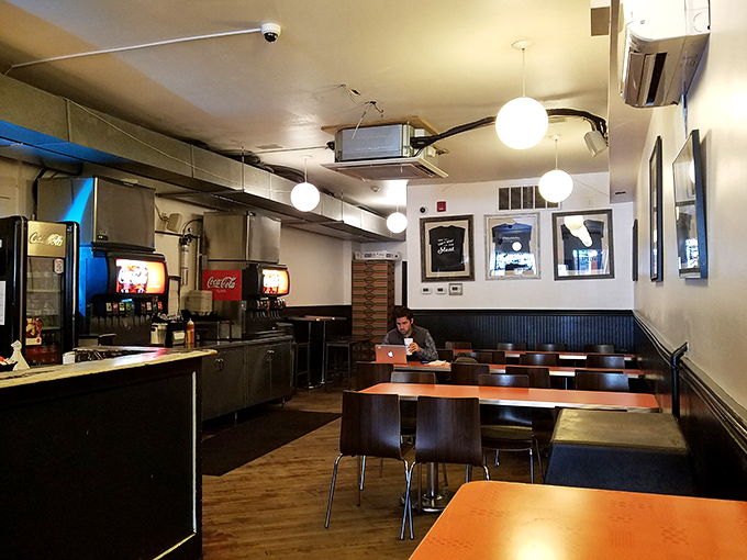 The dining area offers that perfect urban vibe&mdash;unpretentious tables where strangers become temporary friends united by the universal language of good food.