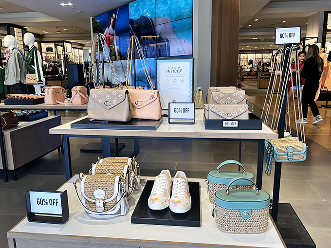 Coach's display of pastel bags and summer accessories proves that 60% off is the most beautiful percentage in mathematics.