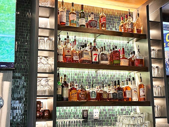 A backlit spirits display that makes choosing your poison a religious experience. Even teetotalers might convert at this altar.