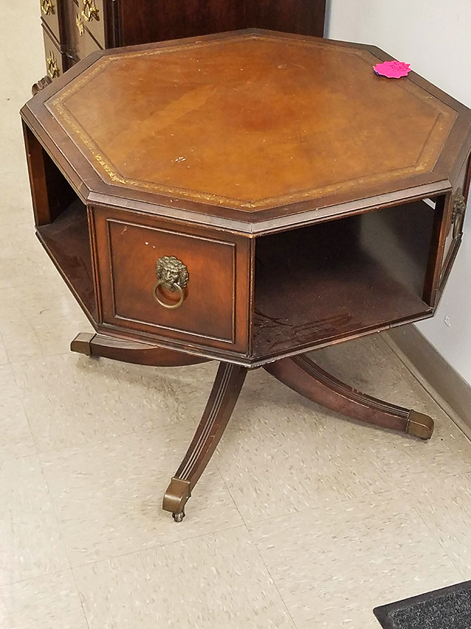 This octagonal end table with lion-head pulls has stories to tell. It's seen more cocktail parties than a veteran bartender.
