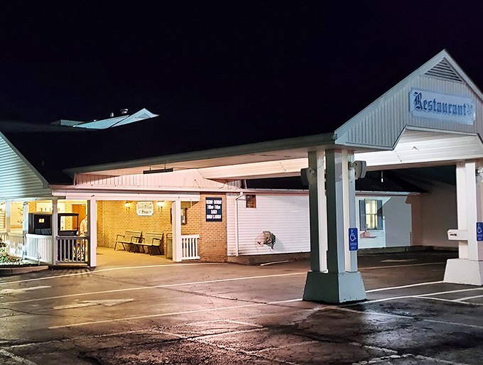 Night falls but the warm glow promises breakfast magic awaits inside, rain or shine.