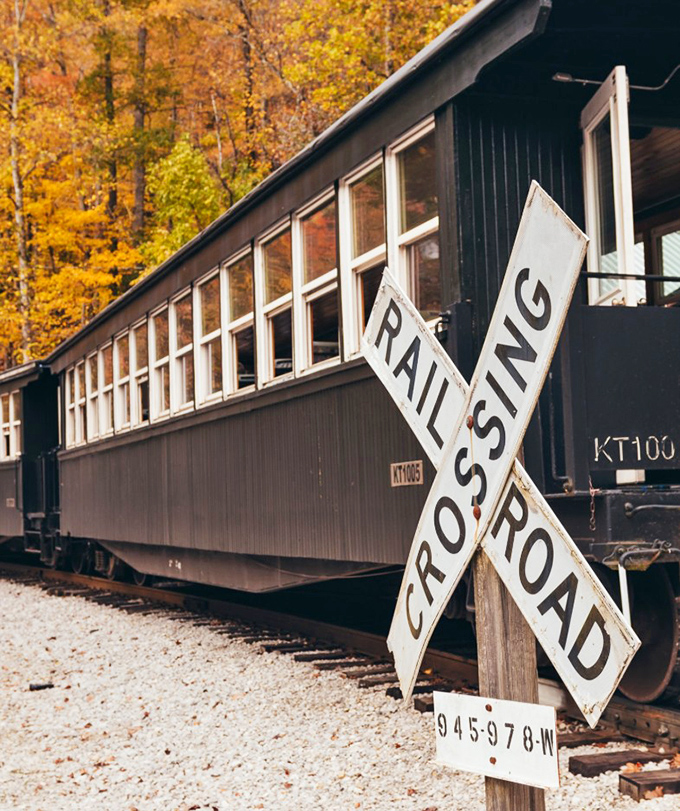 Fall's fiery palette creates the perfect backdrop for this historic passenger car. Leaf peeping reaches Olympic sport status from these windows.