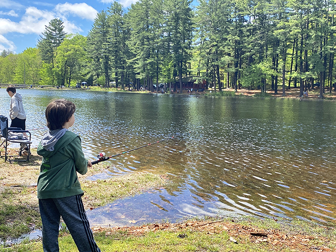 Fishing: where "gone all day, caught nothing" somehow still counts as a perfect afternoon. This young angler might prove luckier.